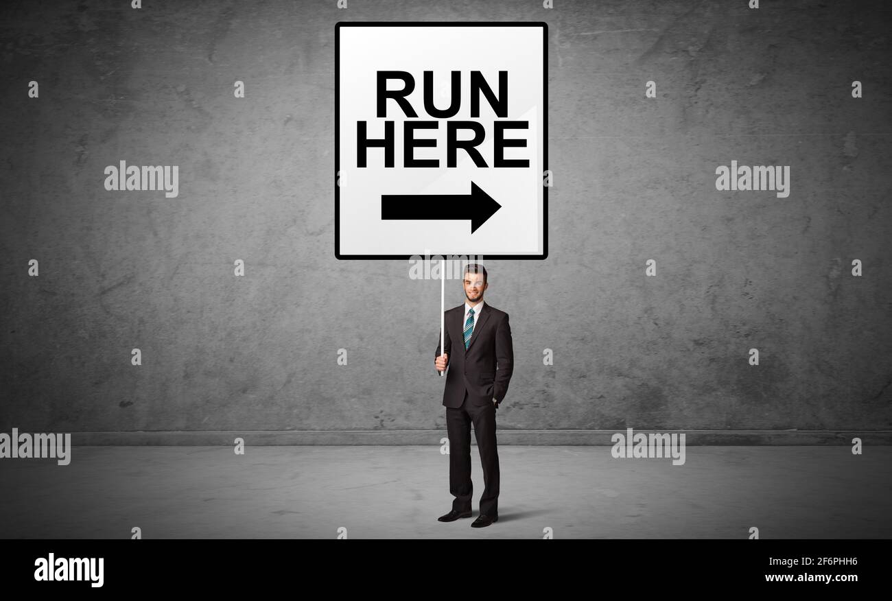 business person holding a traffic sign Stock Photo - Alamy