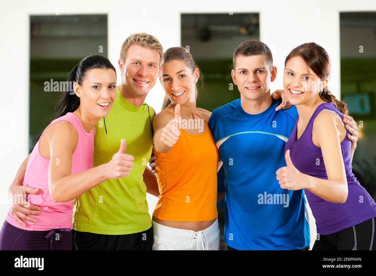 Group of five people exercising in gym or fitness club Stock Photo - Alamy