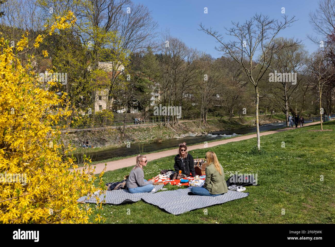 Freiburg, Germany. 02nd Apr, 2021. Three women sit on blankets on the ...