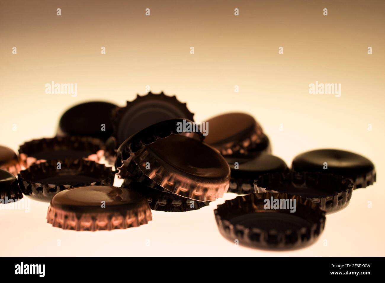beer caps on a light background Stock Photo - Alamy