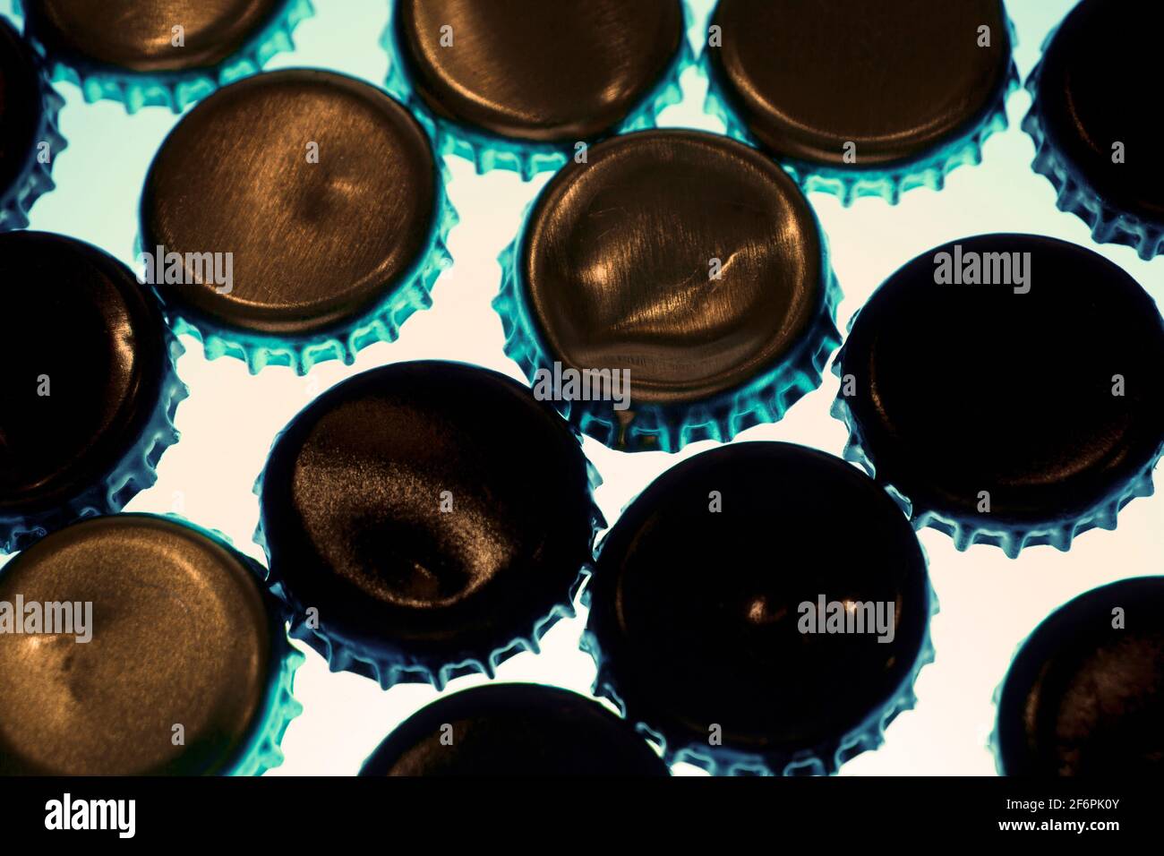beer caps on blue background Stock Photo - Alamy