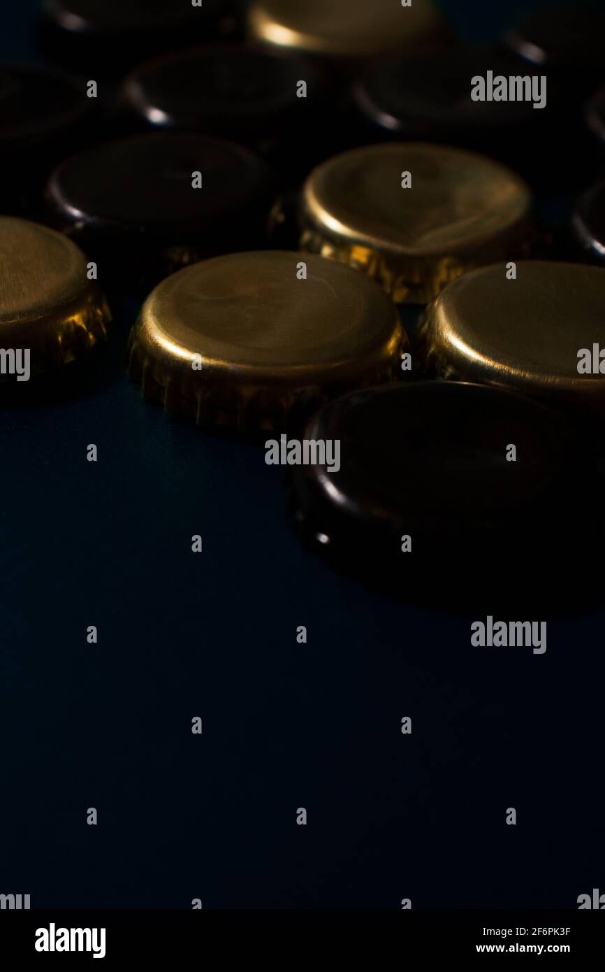 beer lids on a dark surface Stock Photo - Alamy