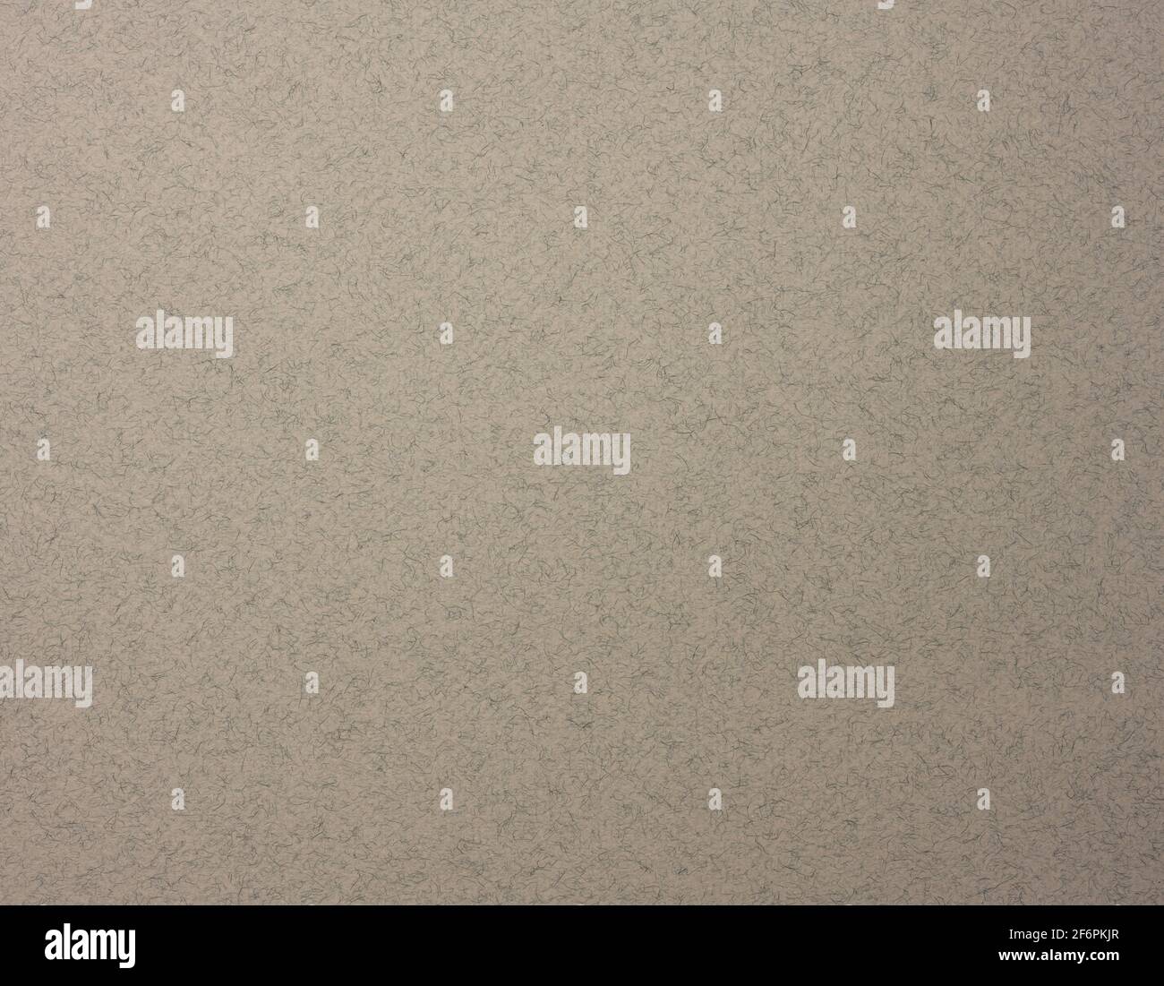 gray cardboard paper texture with black fibers, full frame, close up ...