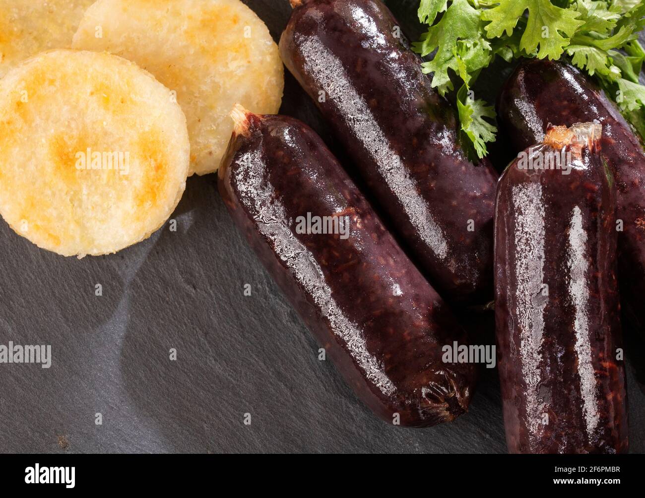 Whole blood sausage. Meat product in natural intestine casings Stock ...