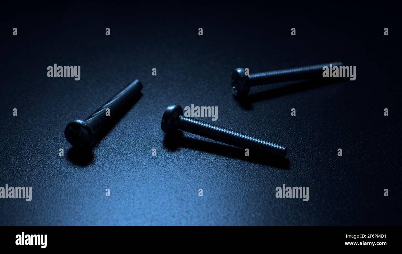 Screws on blue background hi-res stock photography and images - Alamy