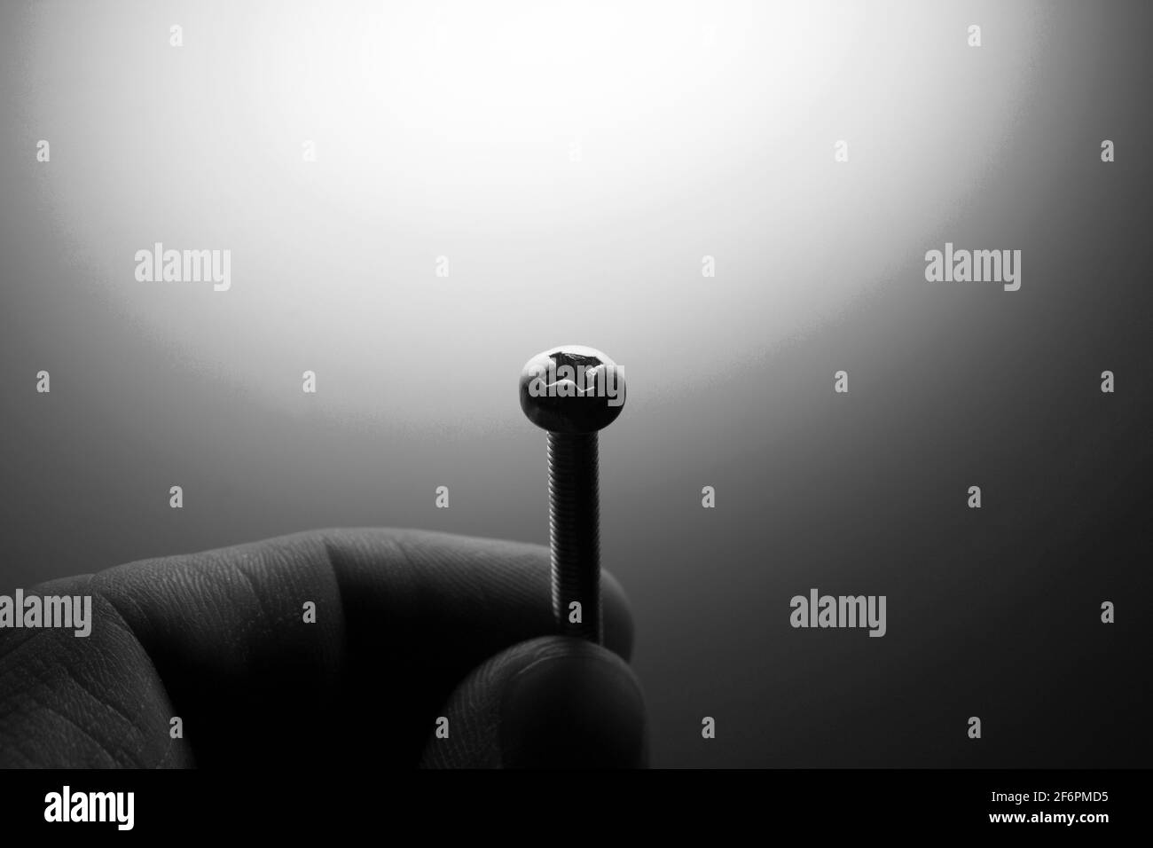 screw in hand on a white background Stock Photo - Alamy