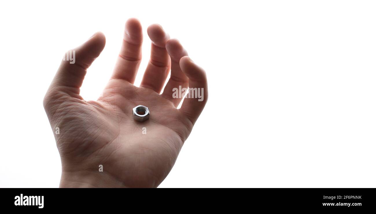 screw-nut in hands on a white background Stock Photo - Alamy