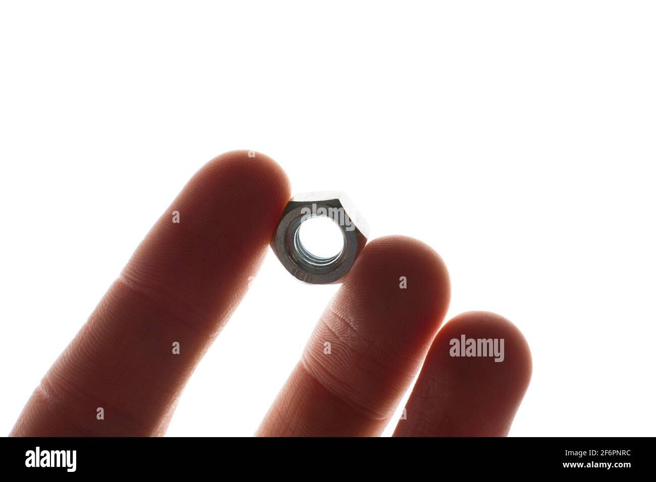 screw-nut in hands on a white background Stock Photo - Alamy