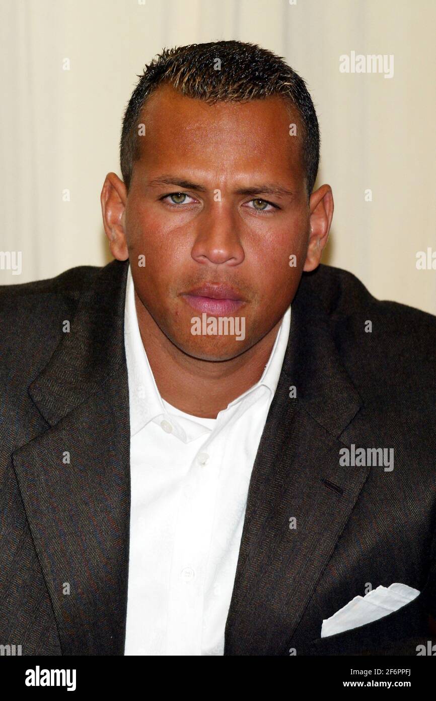 Alex Rodriguez ("A-Rod") poses for photographers before signing copies ...