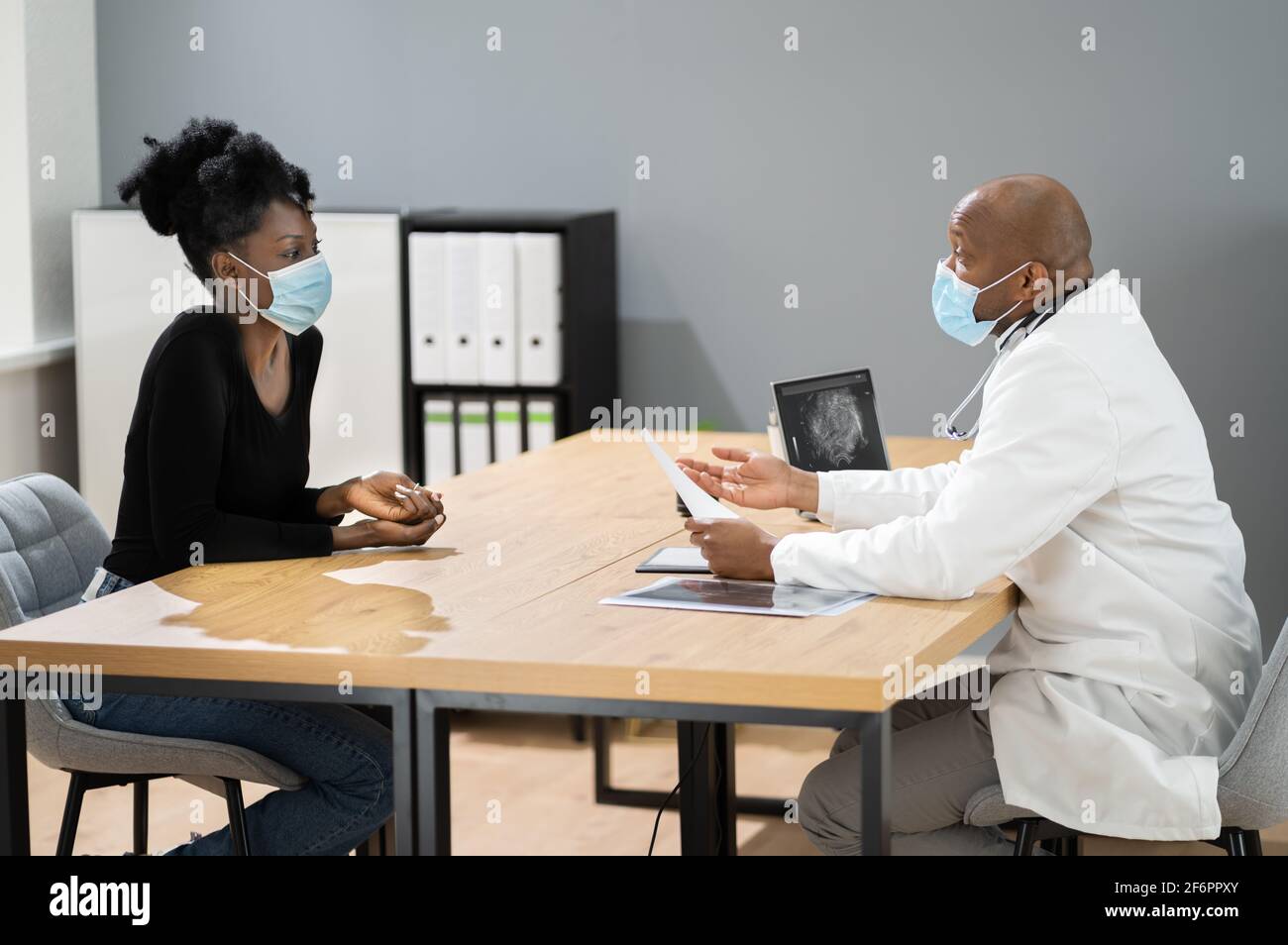 Woman Patient At Doctor With Pregnancy Lab Test Results Stock Photo - Alamy