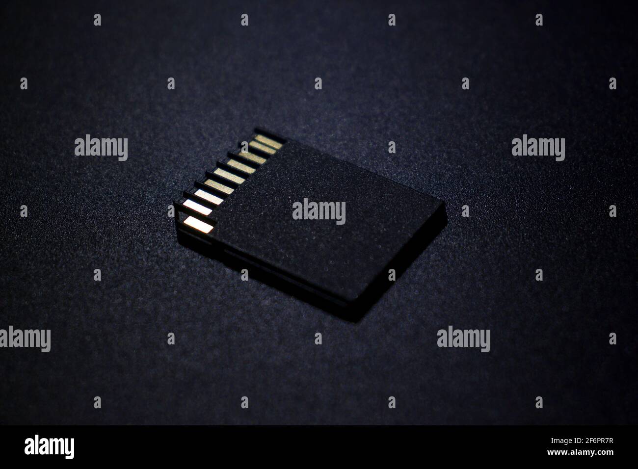 SD card on a dark metal background Stock Photo - Alamy