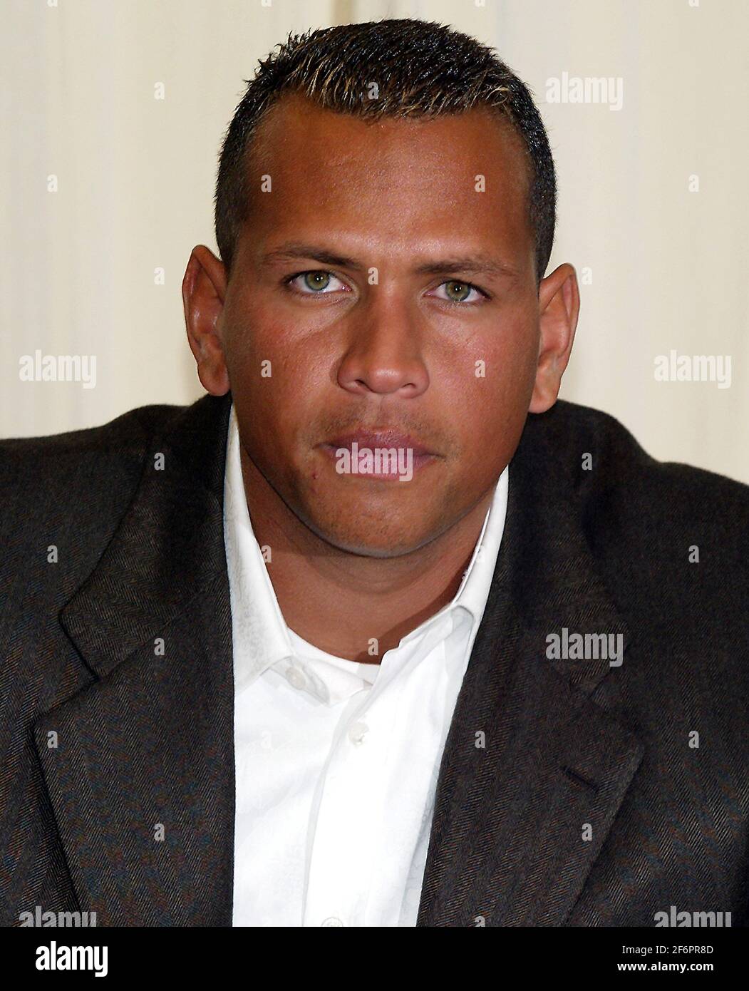 Alex Rodriguez ("A-Rod") poses for photographers before signing copies ...