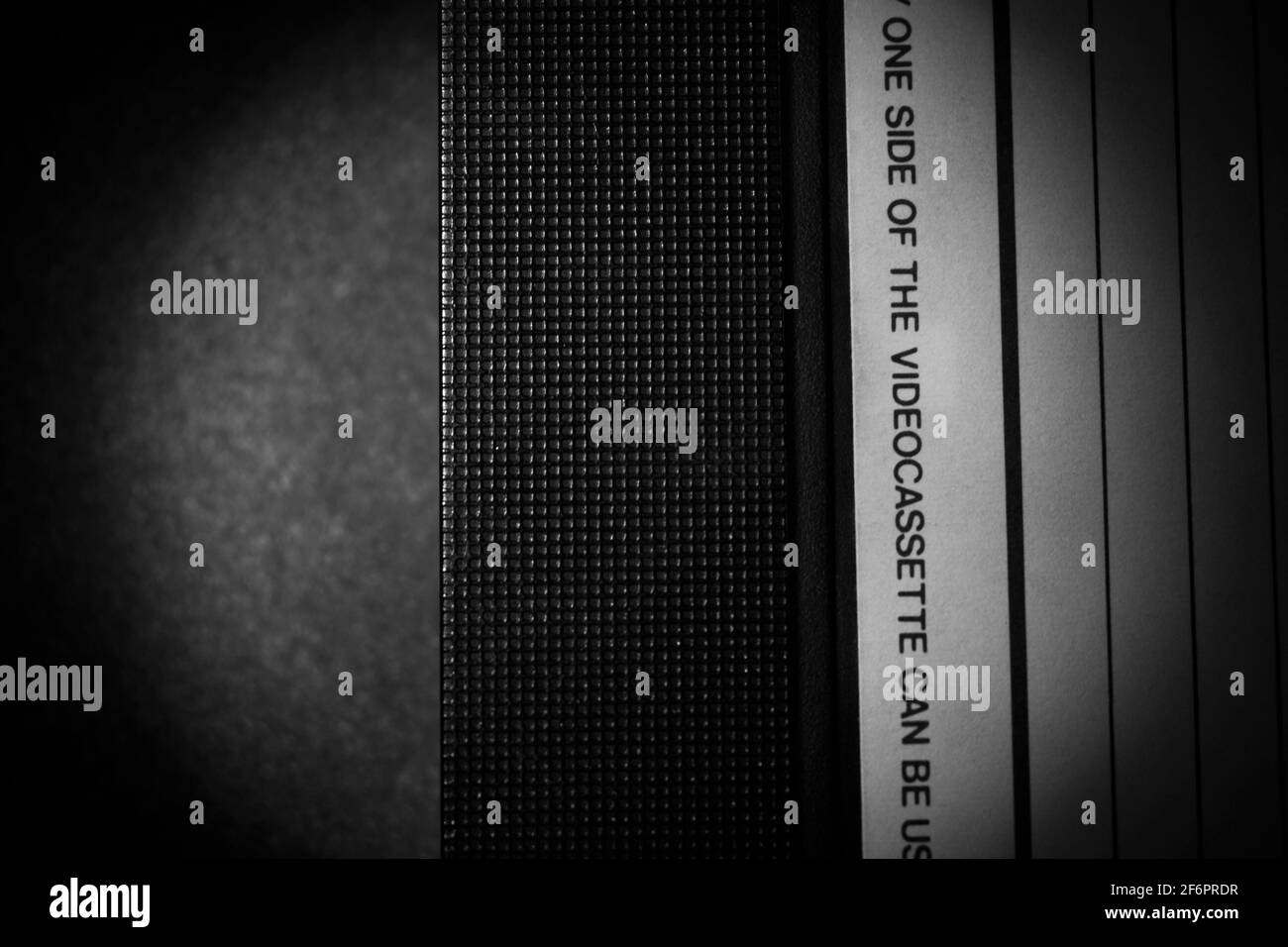 old VHS video cassette against a dark background in black and white ...