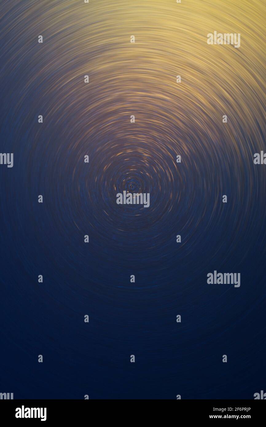 purple and yellow light particles in a circular rotation Stock Photo ...