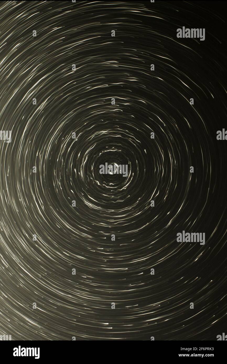 white and black light particles in a circular rotation Stock Photo - Alamy