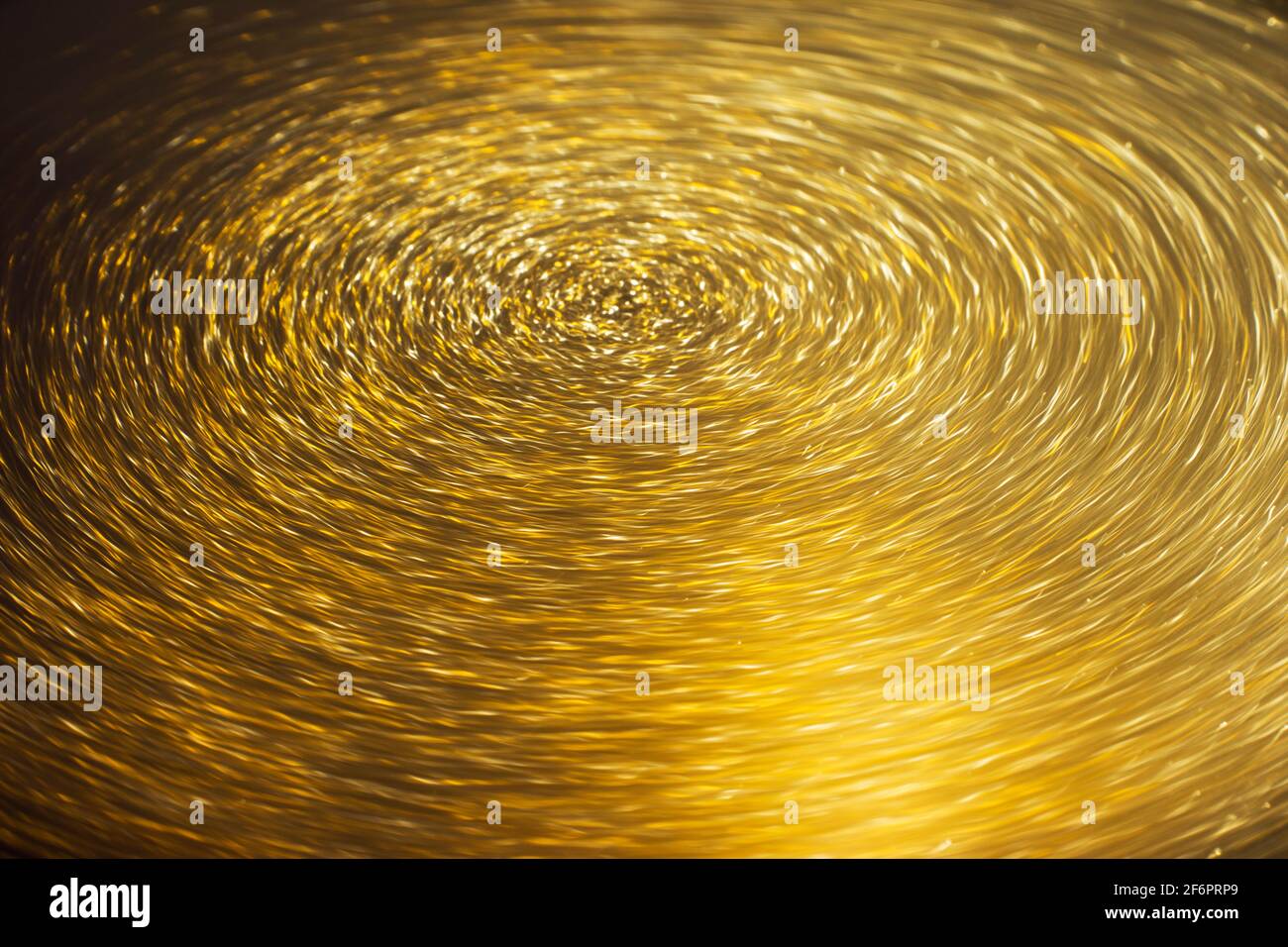 gold and yellow light particles in a circular rotation Stock Photo - Alamy
