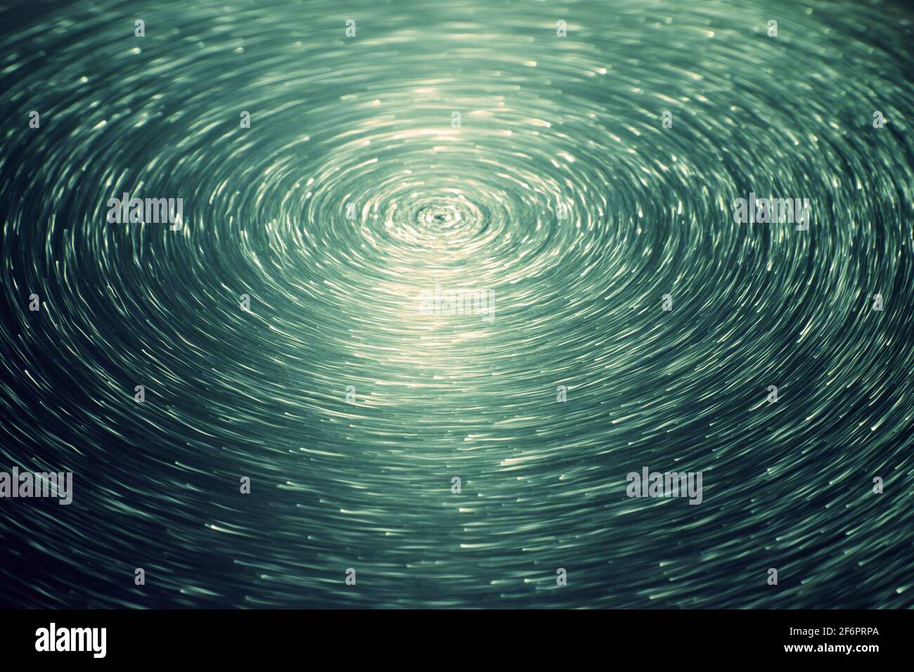 blue and white light particles in a circular rotation Stock Photo - Alamy