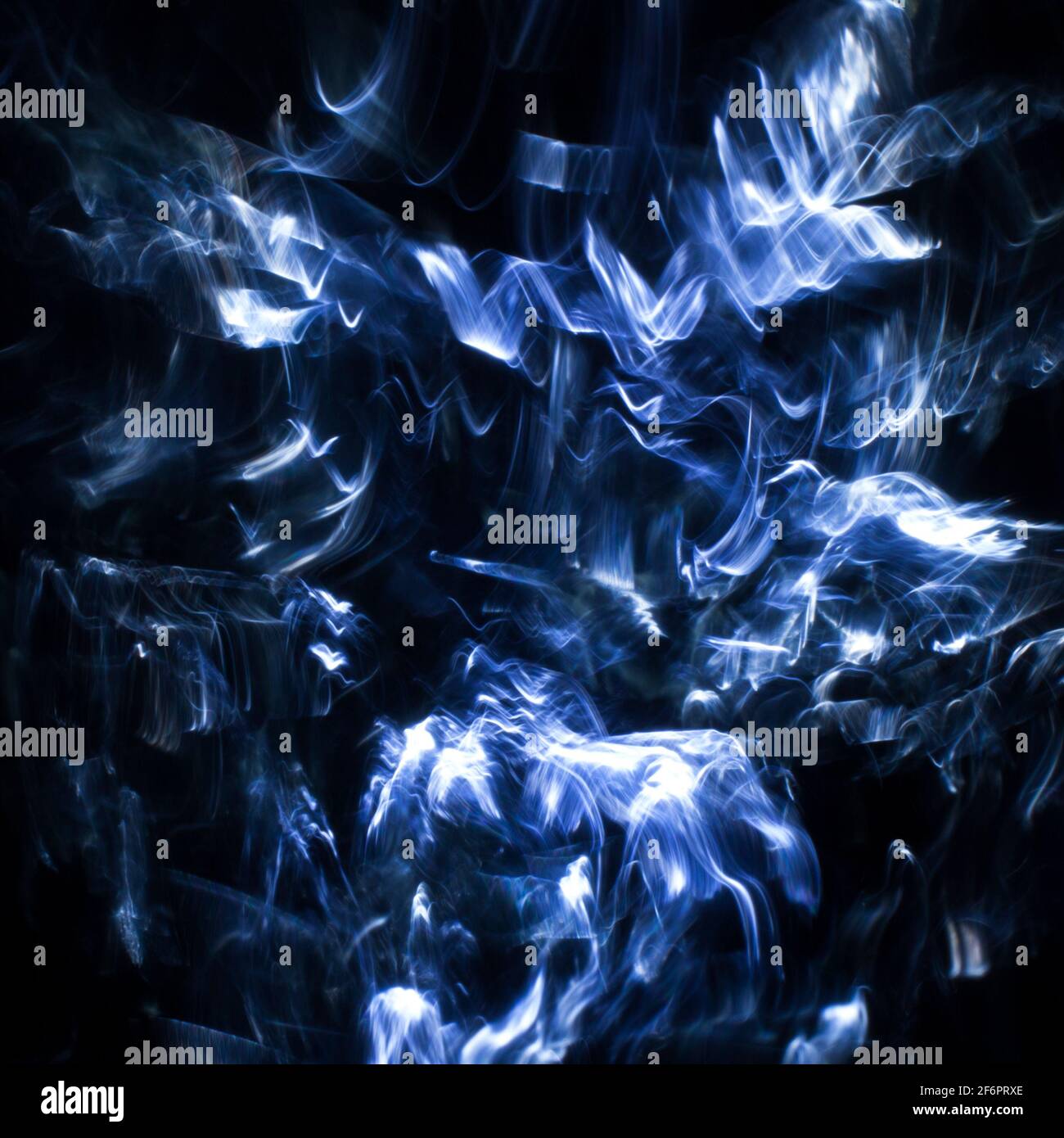 blue light lines curved in an arbitrary shape, on a black background ...