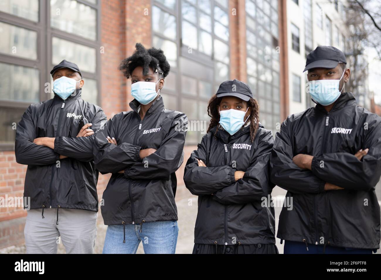 African American Security Officer At Event In Face Mask Stock Photo - Alamy