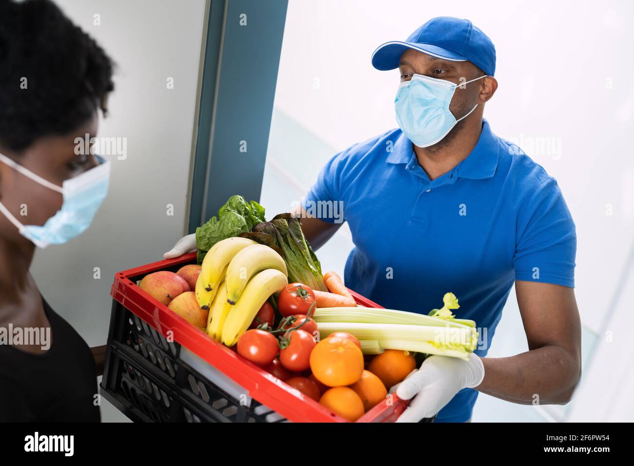 Woman wearing mask carry hi-res stock photography and images - Alamy