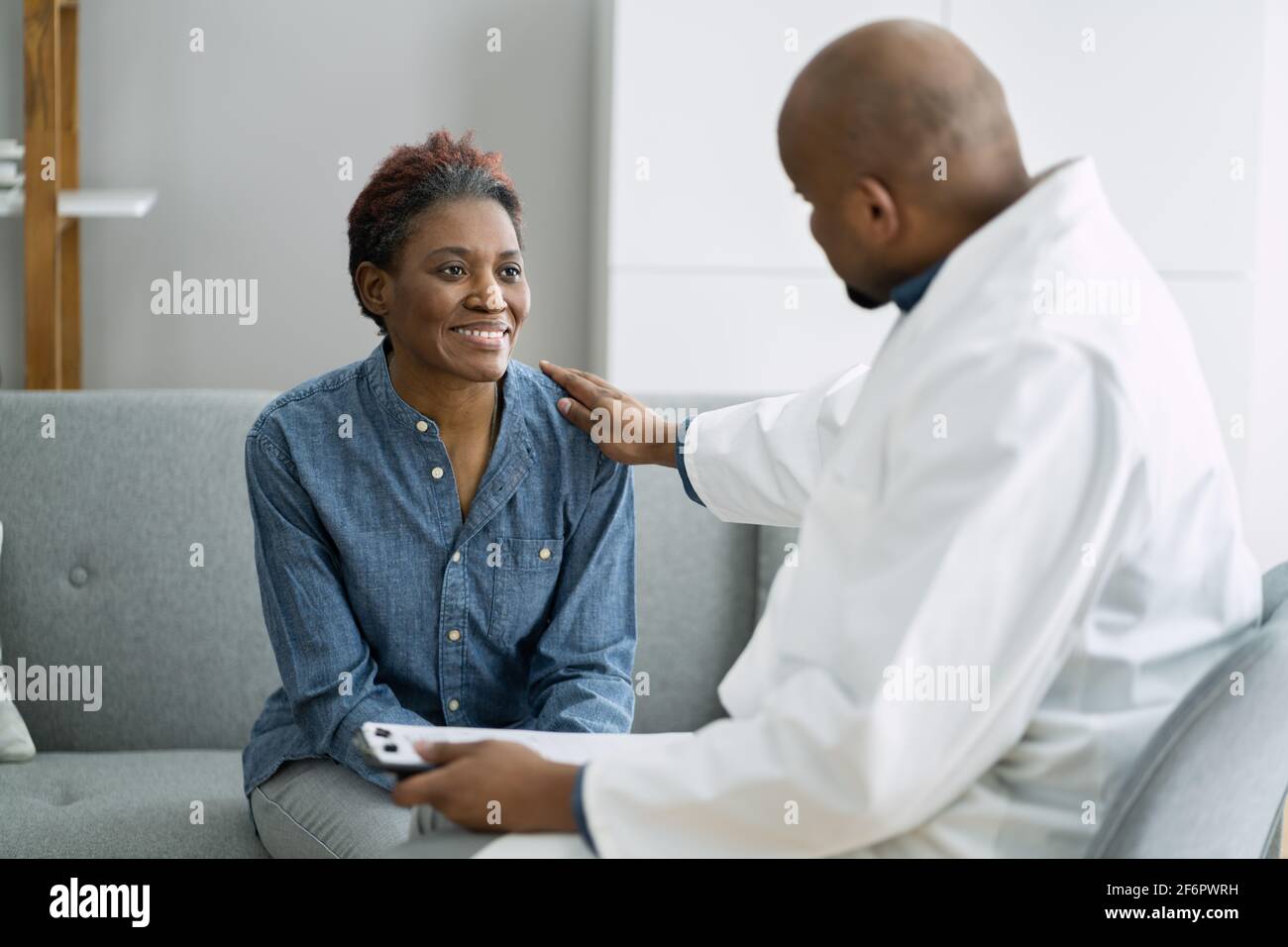 Doctor Talking With Elderly African Patient. Elder Healthcare Stock ...