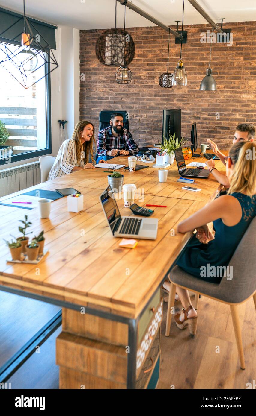 Business people laughing in a meeting hi-res stock photography and ...