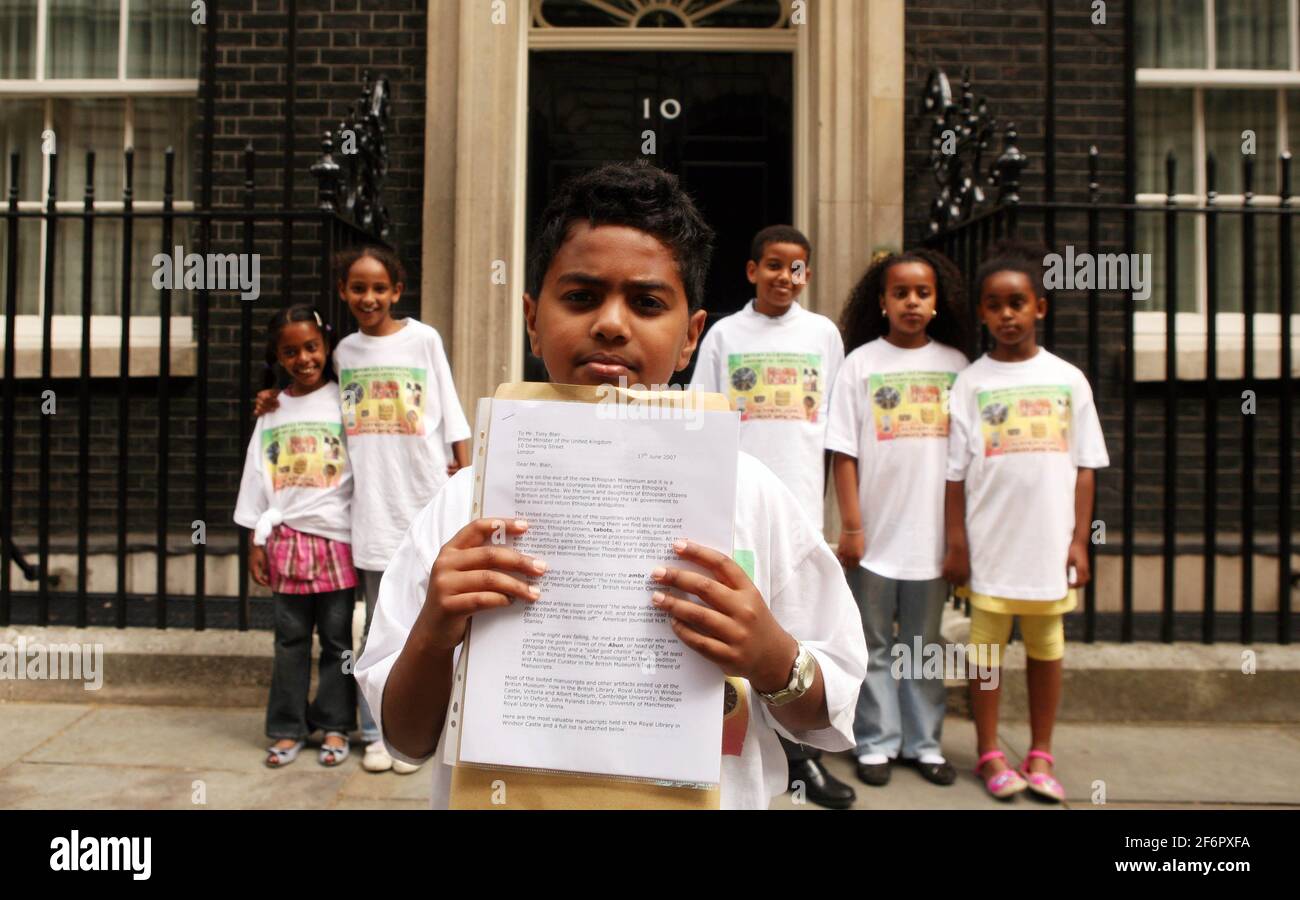 9 Year old Gabriel Kassayie delivers a petition to 10 Downing street ...