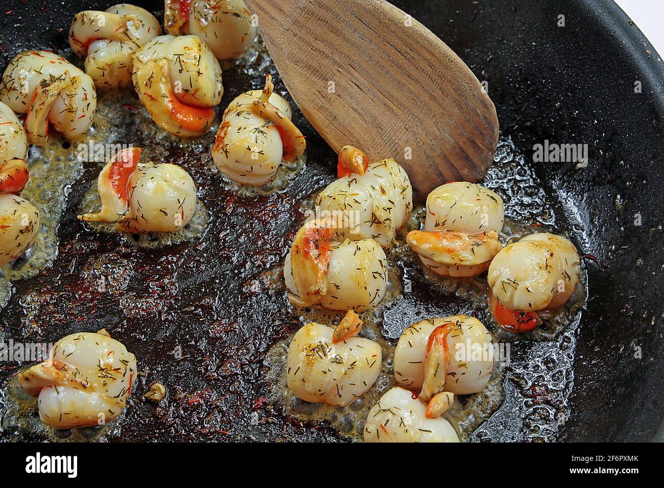 cooking of scallops in a pan Stock Photo - Alamy