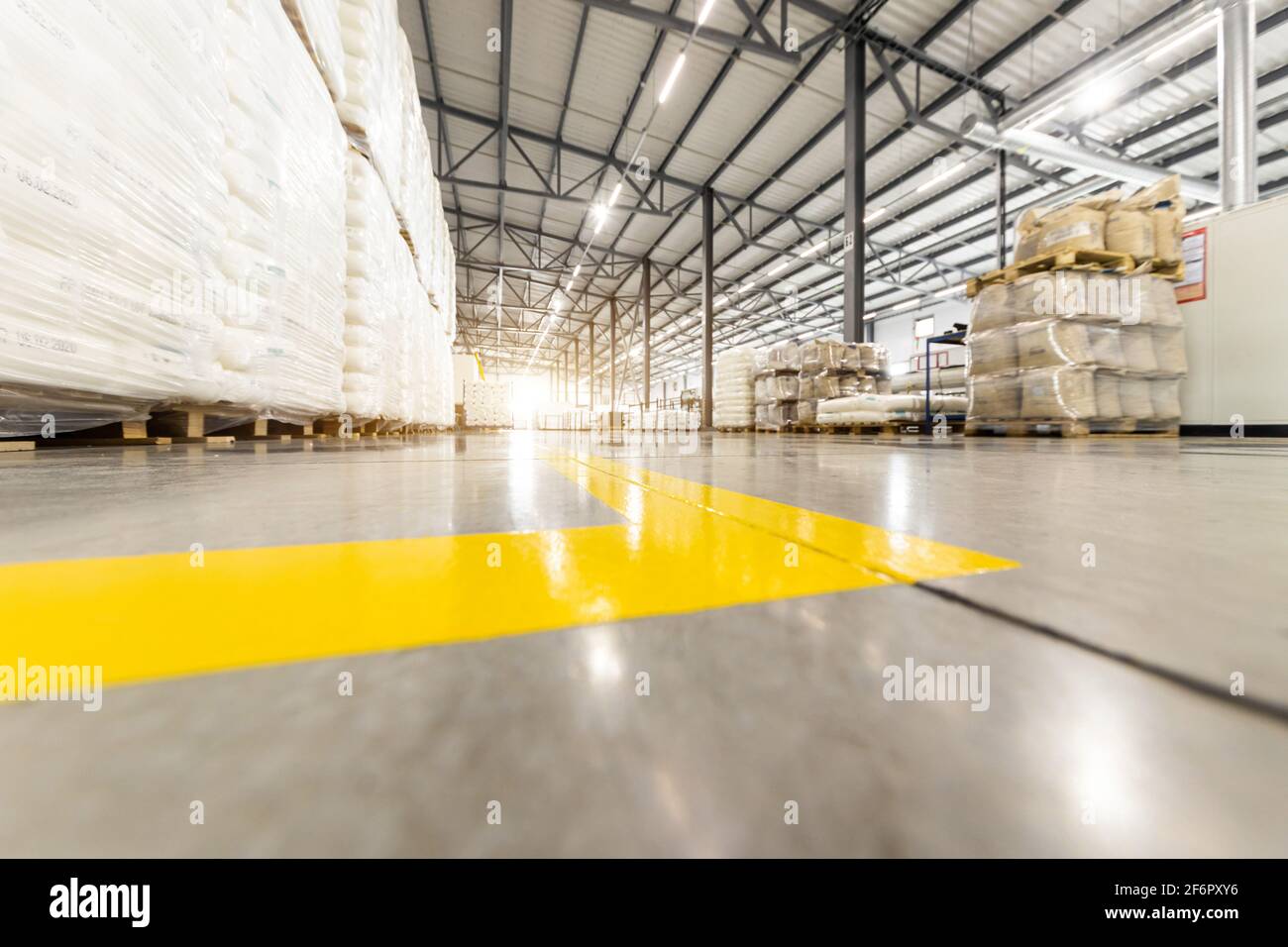 Spacious light interior of a large warehouse in a factory with special ...