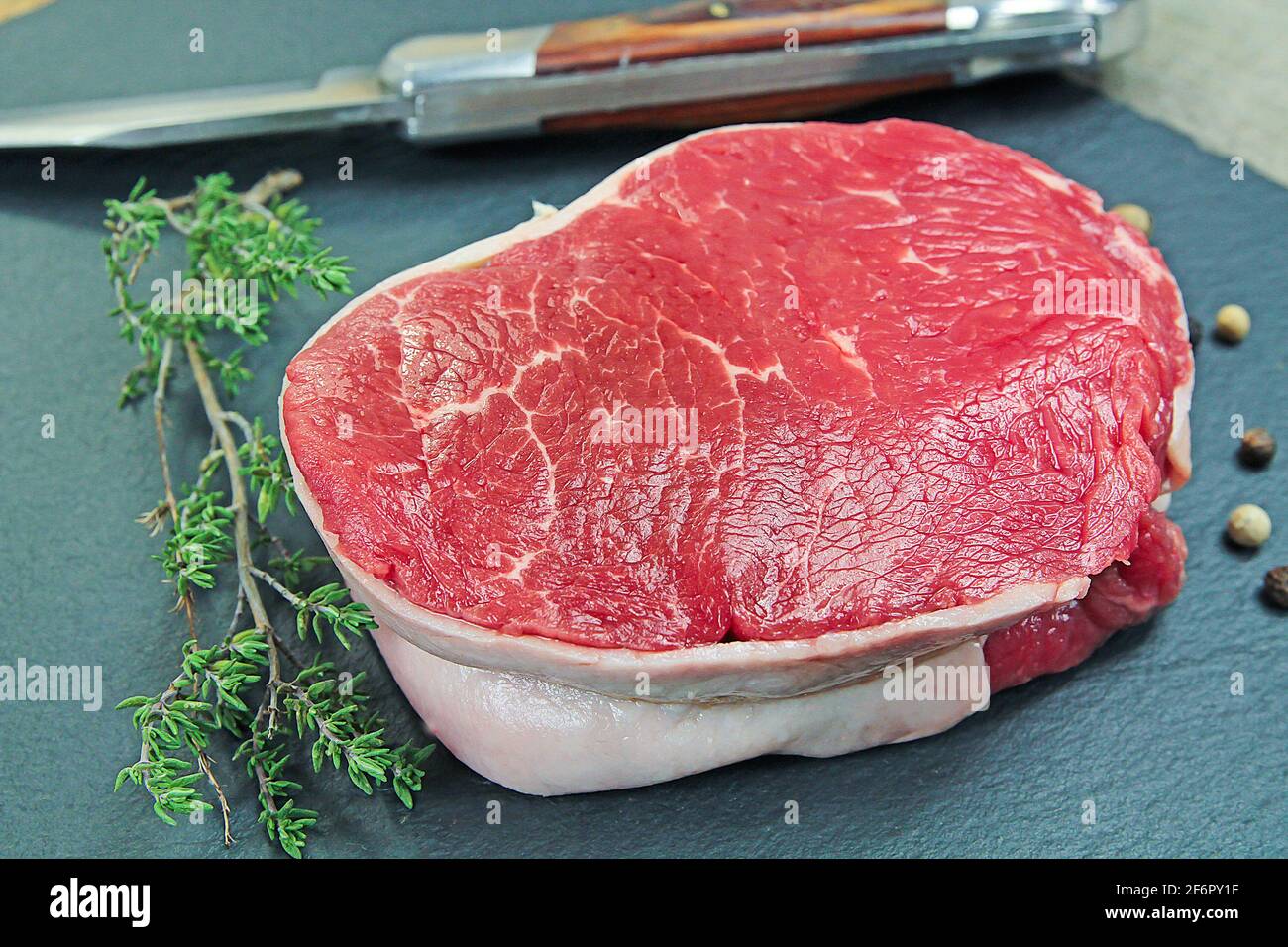 raw beef tournedos on a cutting board Stock Photo - Alamy