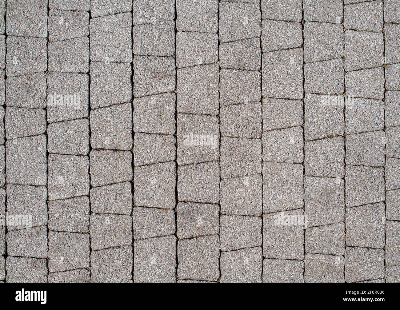 Trapeze-shaped gray paving tile Stock Photo - Alamy