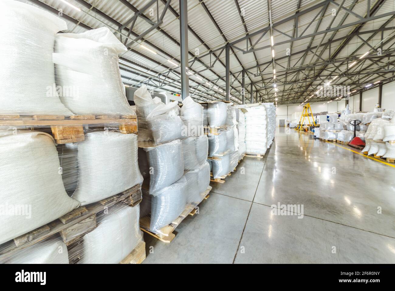 Spacious light interior of a large warehouse in a factory with special ...