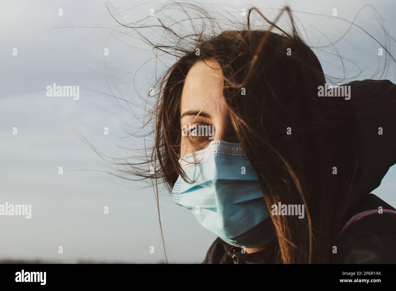 Wind blown face mask hi-res stock photography and images - Alamy