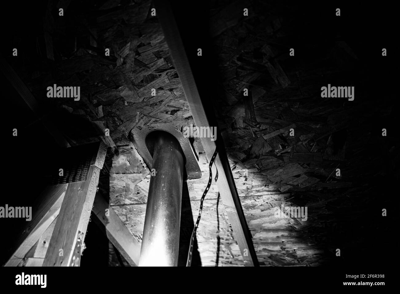 Attic view of installation of a galvanized vent pipe through a roof ...