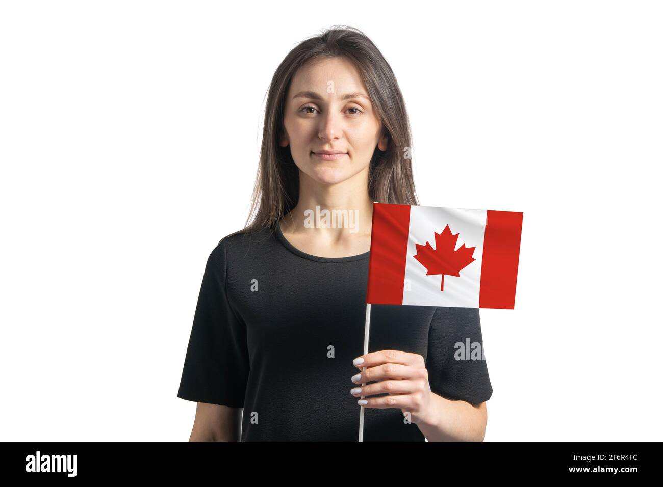 Happy young white girl holding Canada flag isolated on a white ...