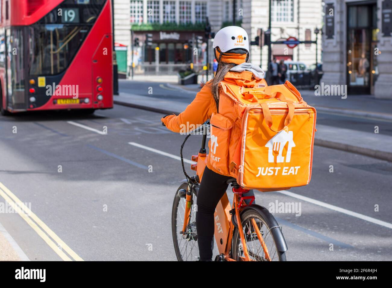 London, UK. 02nd Apr, 2021. Just Eat courier rides along Piccadilly ...