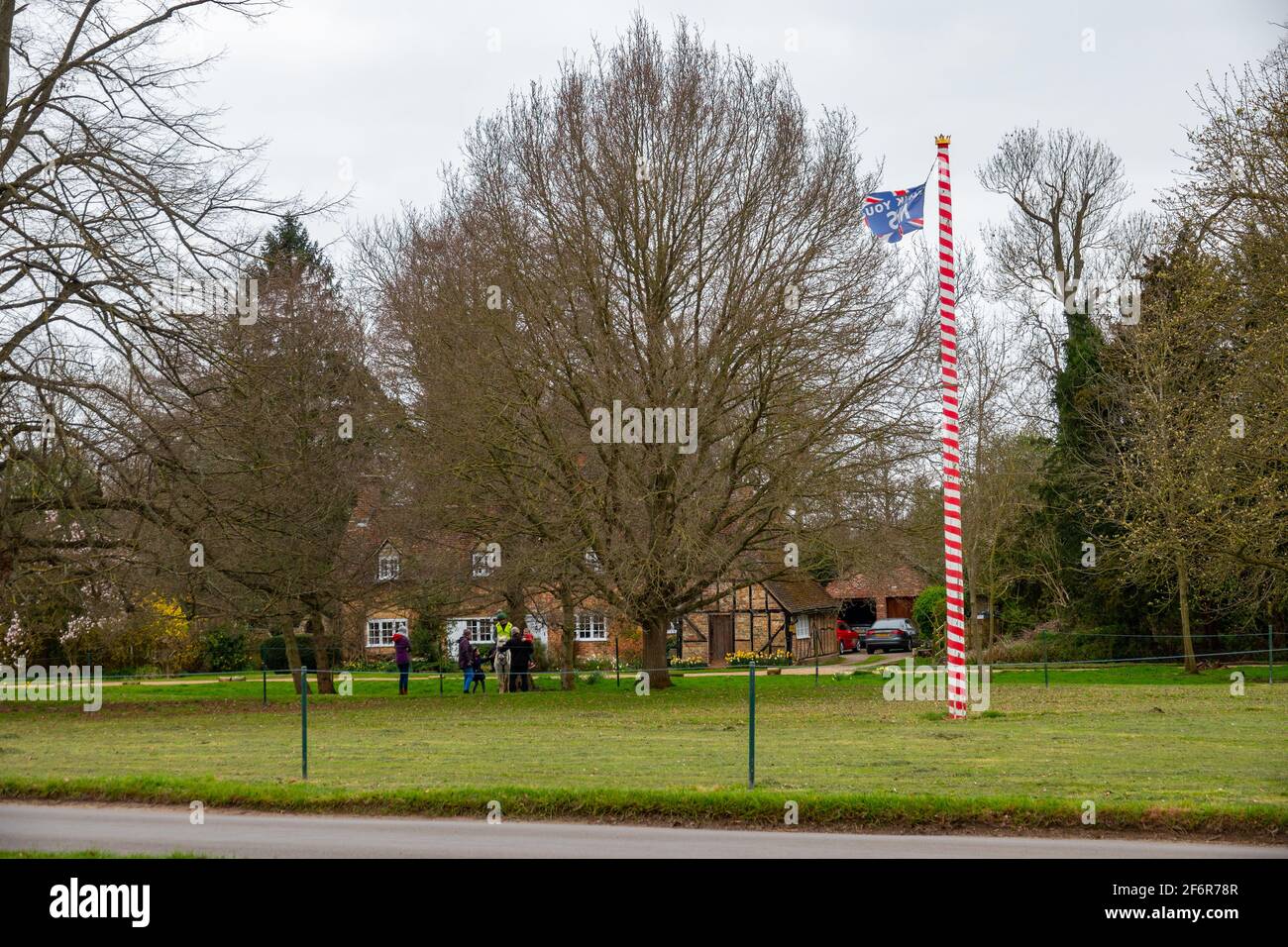 Red and white wrapped Maypole on the green in Ickwell, Bedfordshire, UK ...