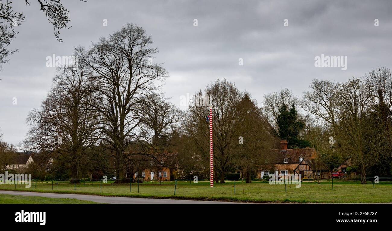 Red and white wrapped Maypole on the green in Ickwell, Bedfordshire, UK ...