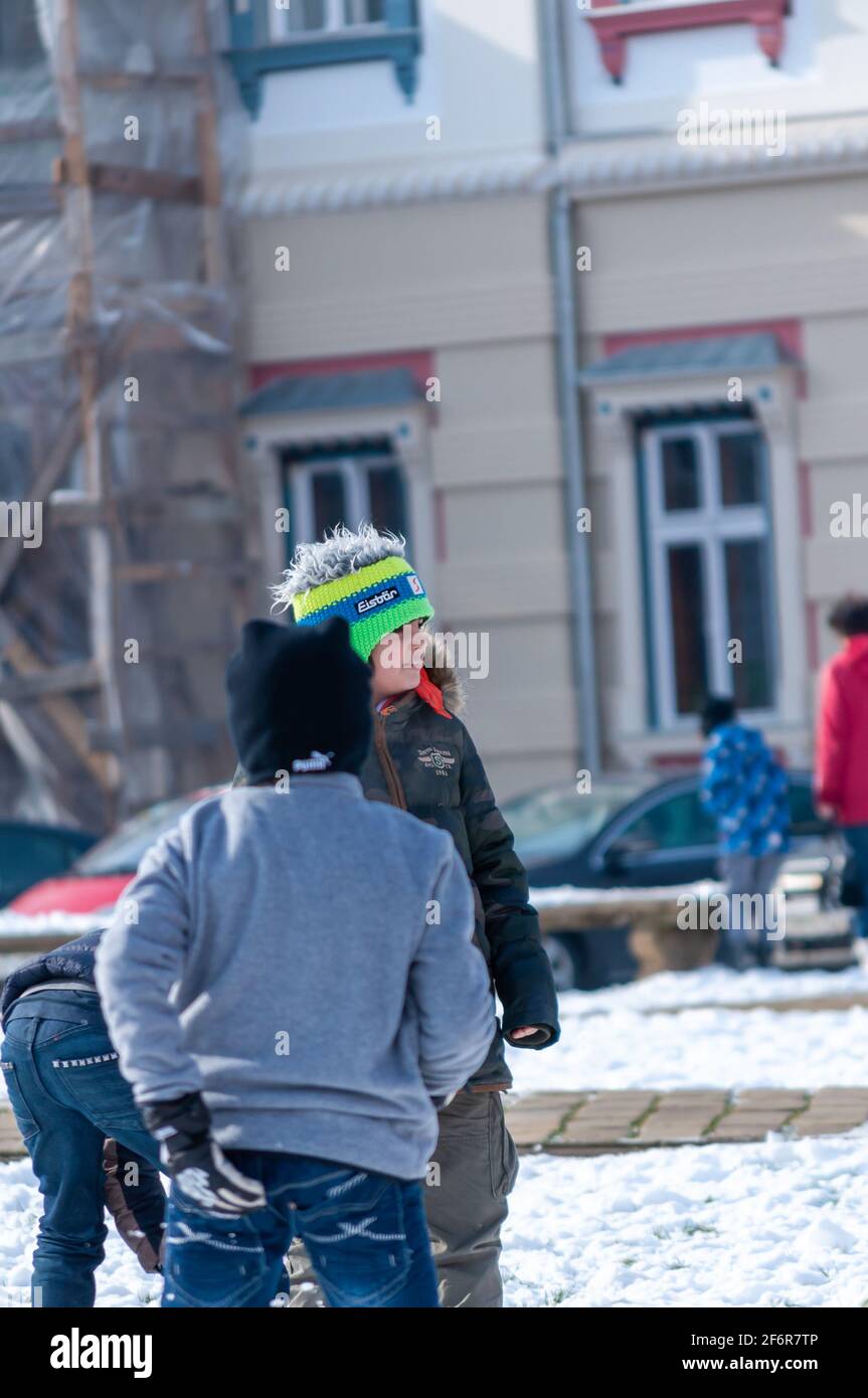 Timisoara, Romania - January 30, 2014: Kids playing with snow in the ...