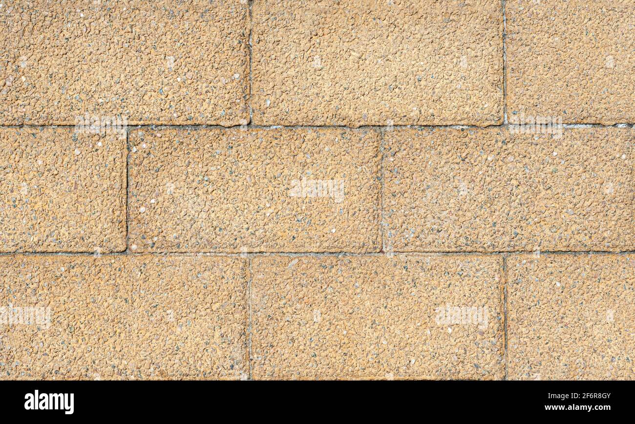 Texture of a gray - brown stone wall close-up. Stone wall background ...