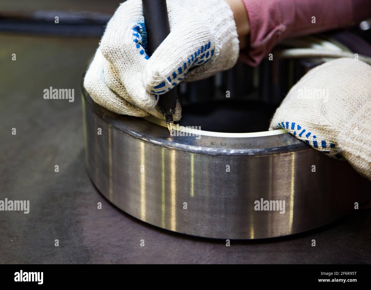 Bearing production plant. Engraving ready bearing with electric-arc ...