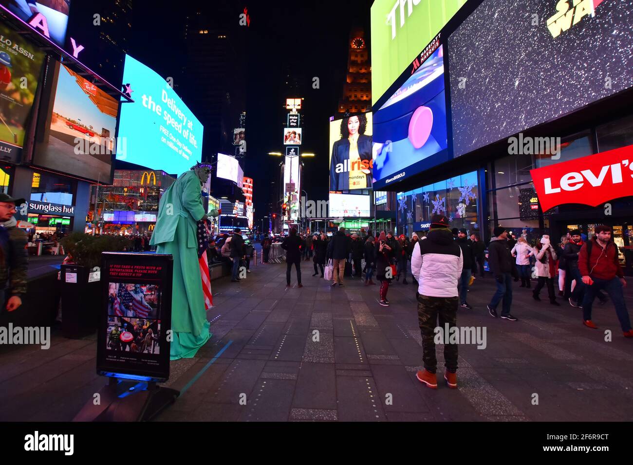 Night scene in Times Square with billboards, advertisements and Liberty ...