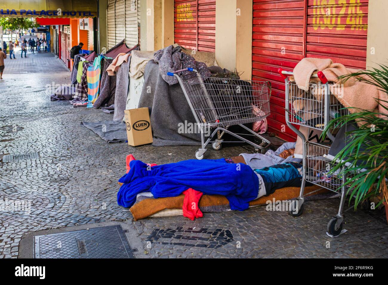 Homeless woman sleeping on street hi-res stock photography and images ...