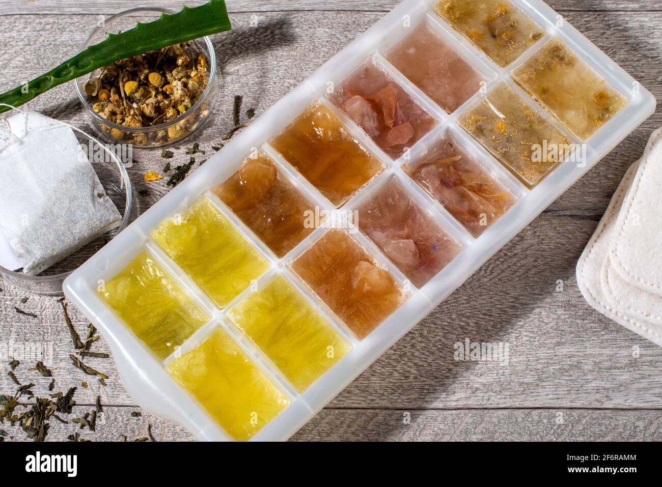 Ice cubes with different types of tea. Home made skin treatment Stock ...