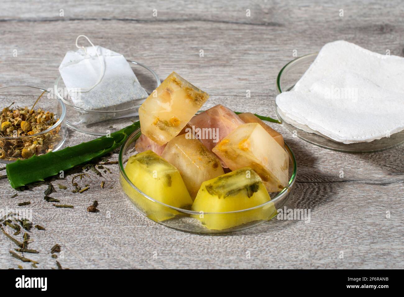 Ice cubes with different types of tea. Home made skin treatment Stock ...