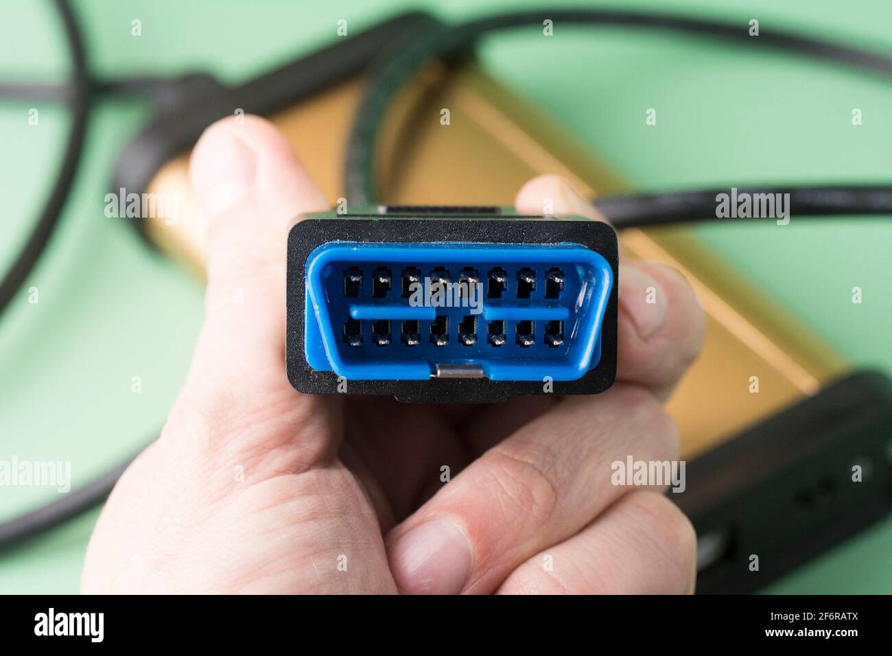 Electrician holds in hands computer car diagnostic error scanner OBD2 ...