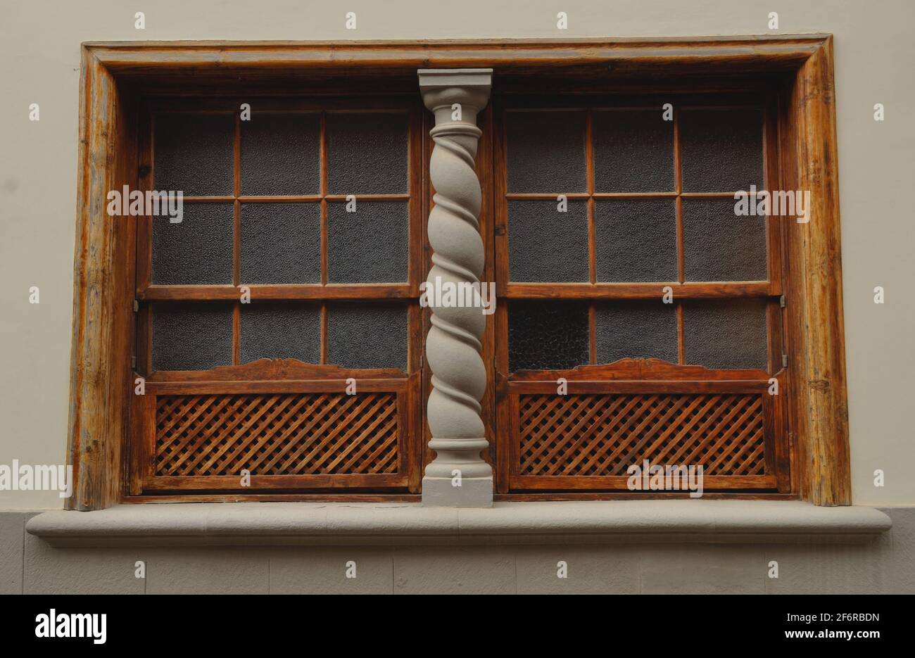 the stone column that protects the wooden window Stock Photo - Alamy