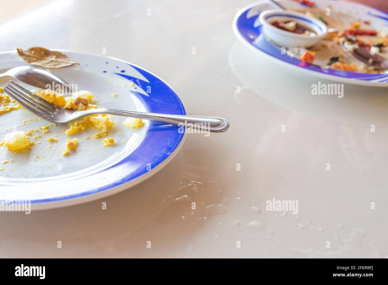 Dirty plates kitchen table hi-res stock photography and images - Alamy