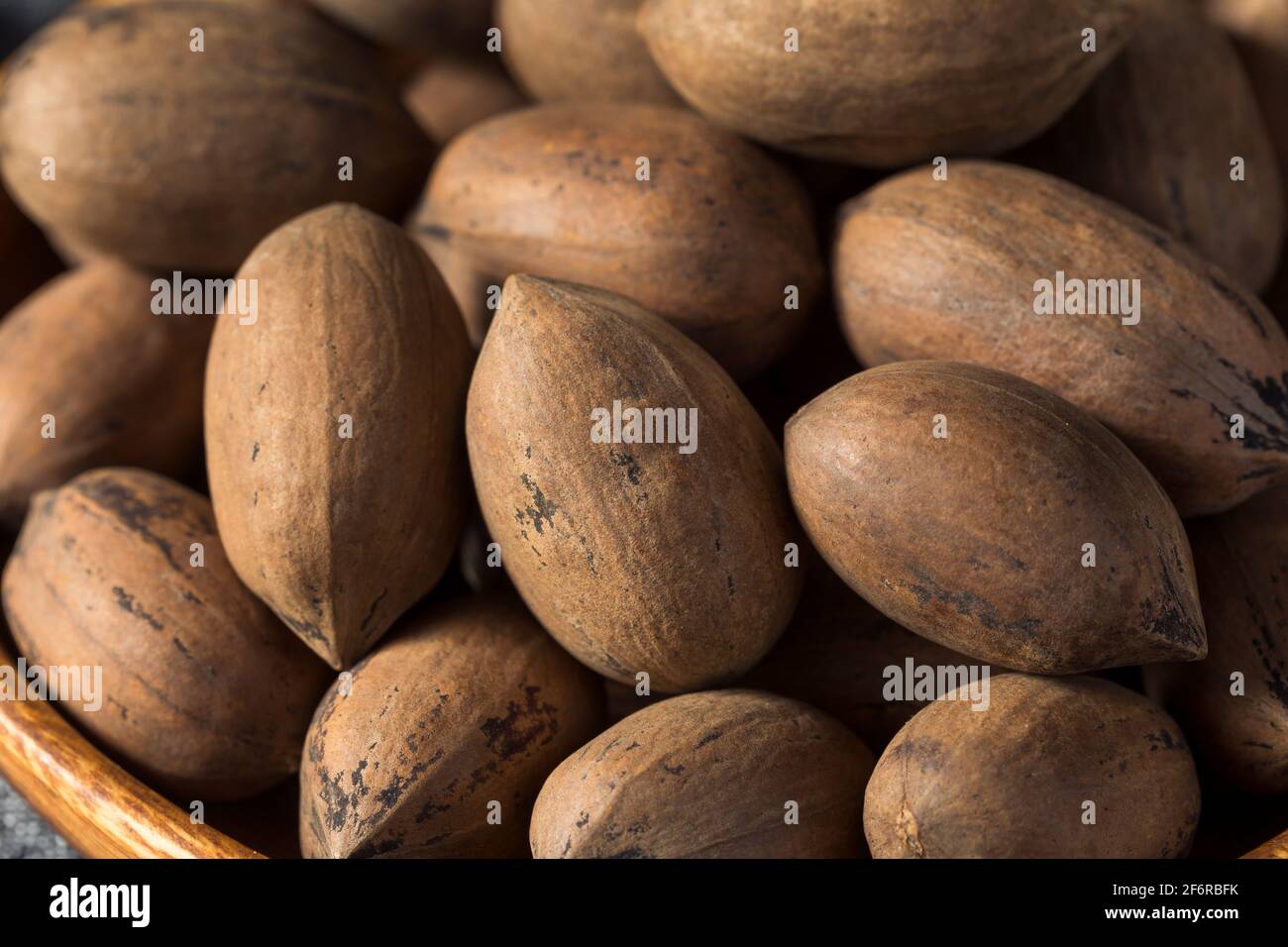 Raw Organic Whole Pecan Nuts in a Bowl Stock Photo - Alamy
