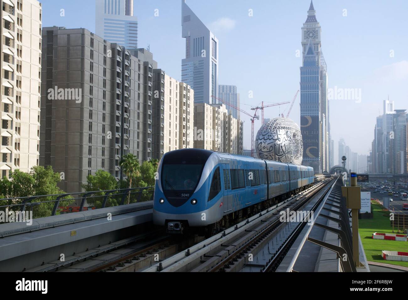 DUBAI, UNITED ARAB EMIRATES - JUN 19, 2019: Metro Dubai train with city ...
